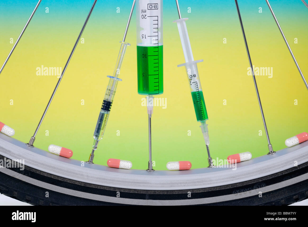 Injection needles in the spokes of a racing cycle tyre, symbolic ...