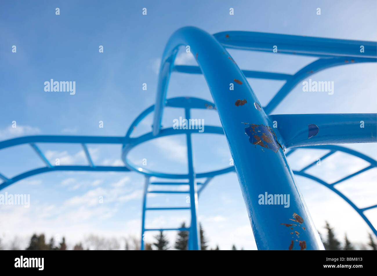Blue outdoor children playground with a close up of a blue spider ...