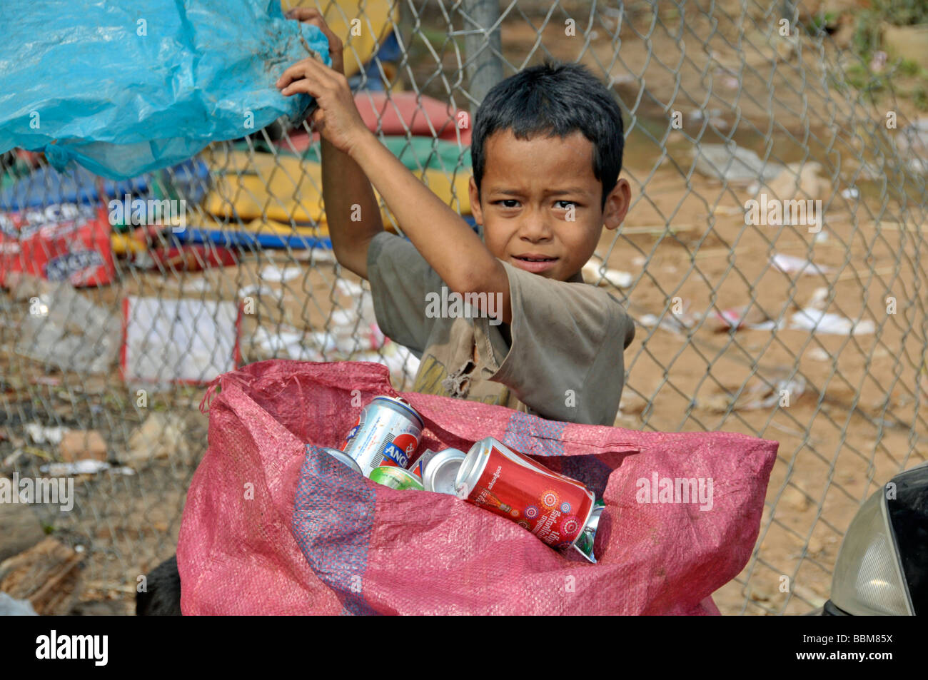 Homeless child collecting cans, Poipet, Cambodia, Asia Stock Photo - Alamy