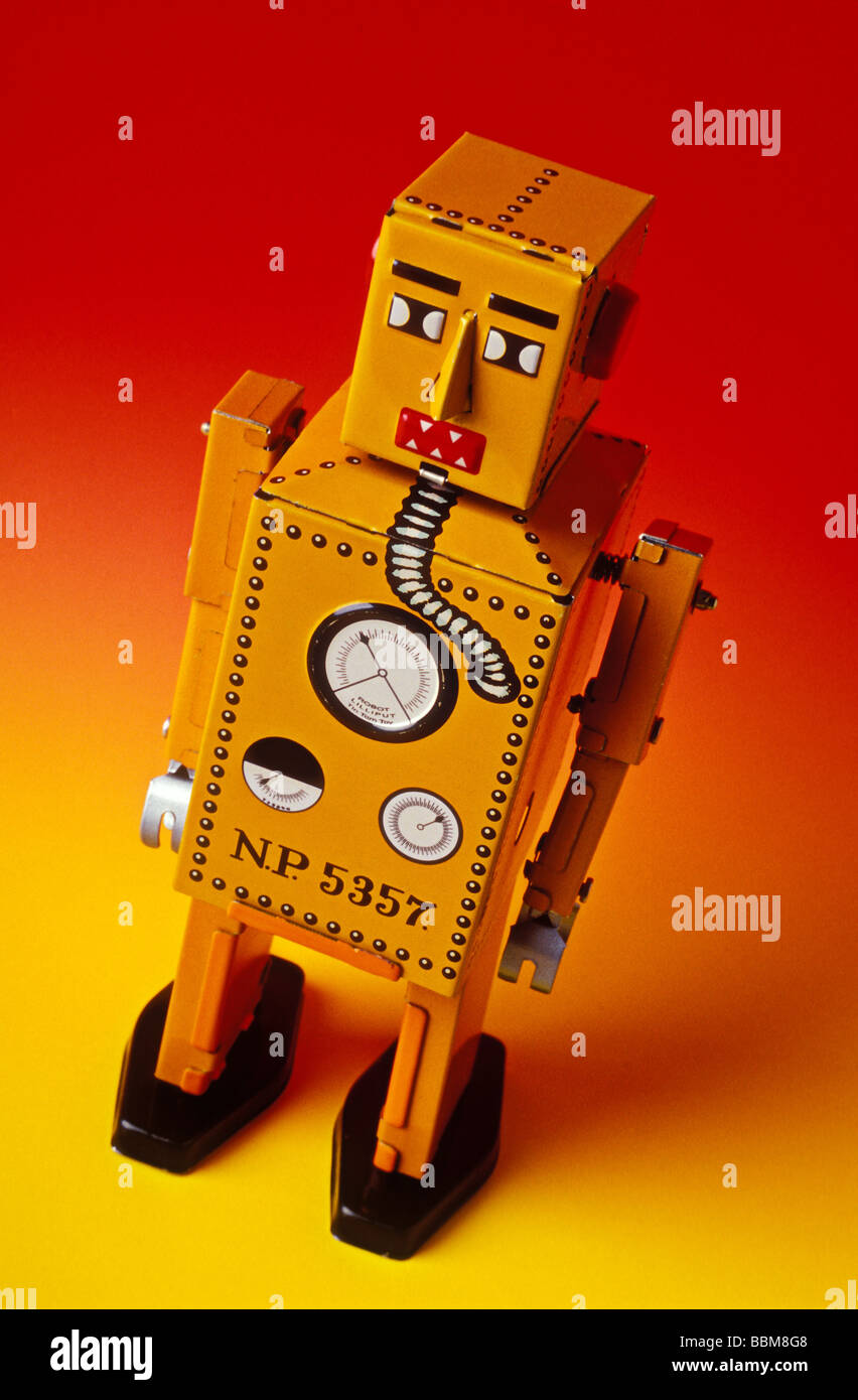 Yellow metal toy robot Stock Photo - Alamy