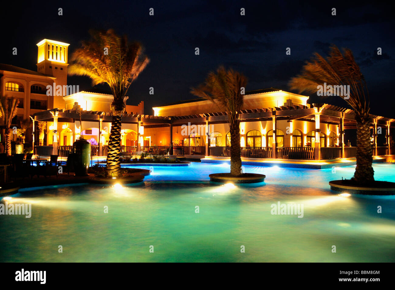 Swimming pool of the Desert Islands Resort and Spa at night, Sir Bani ...