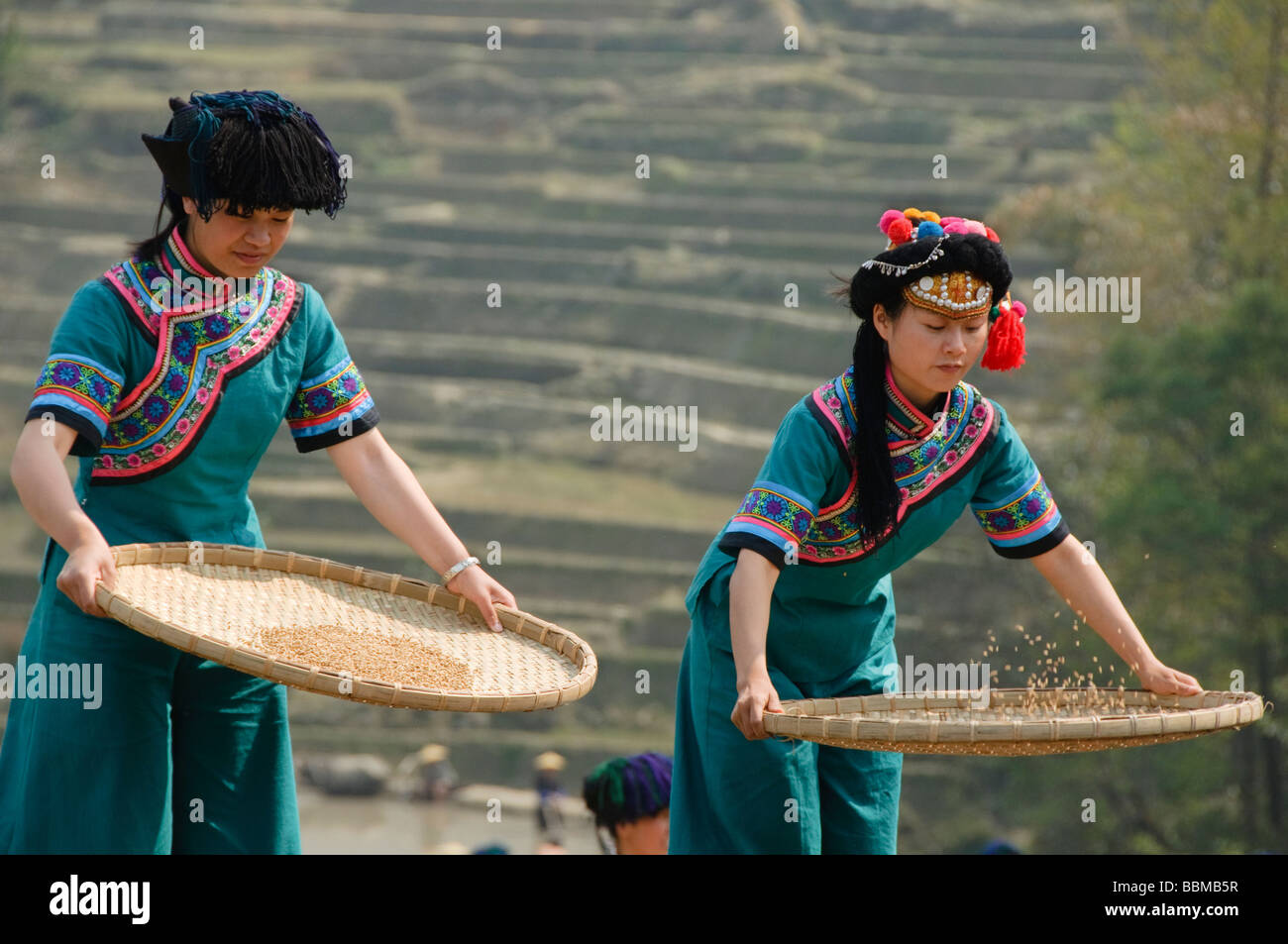 Hani Akha women sifting rice at a festival in Yuanyang China Stock ...