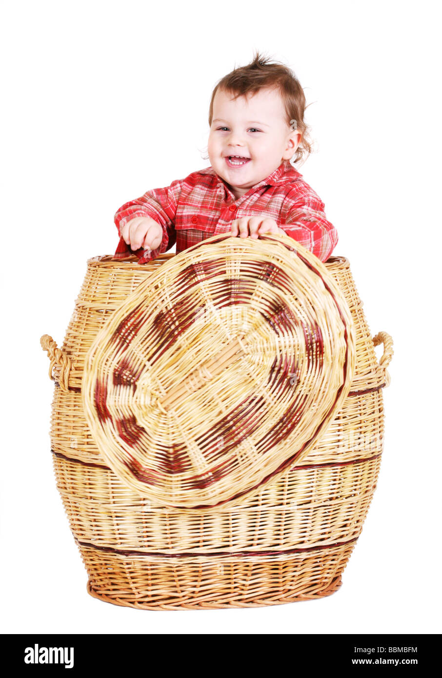 Baby boy sitting in basket Stock Photo - Alamy