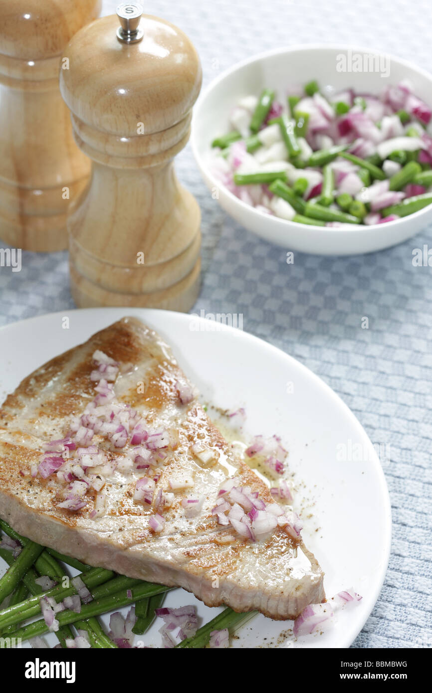 Seared Tuna Steak with Beans and Red Onion Stock Photo - Alamy
