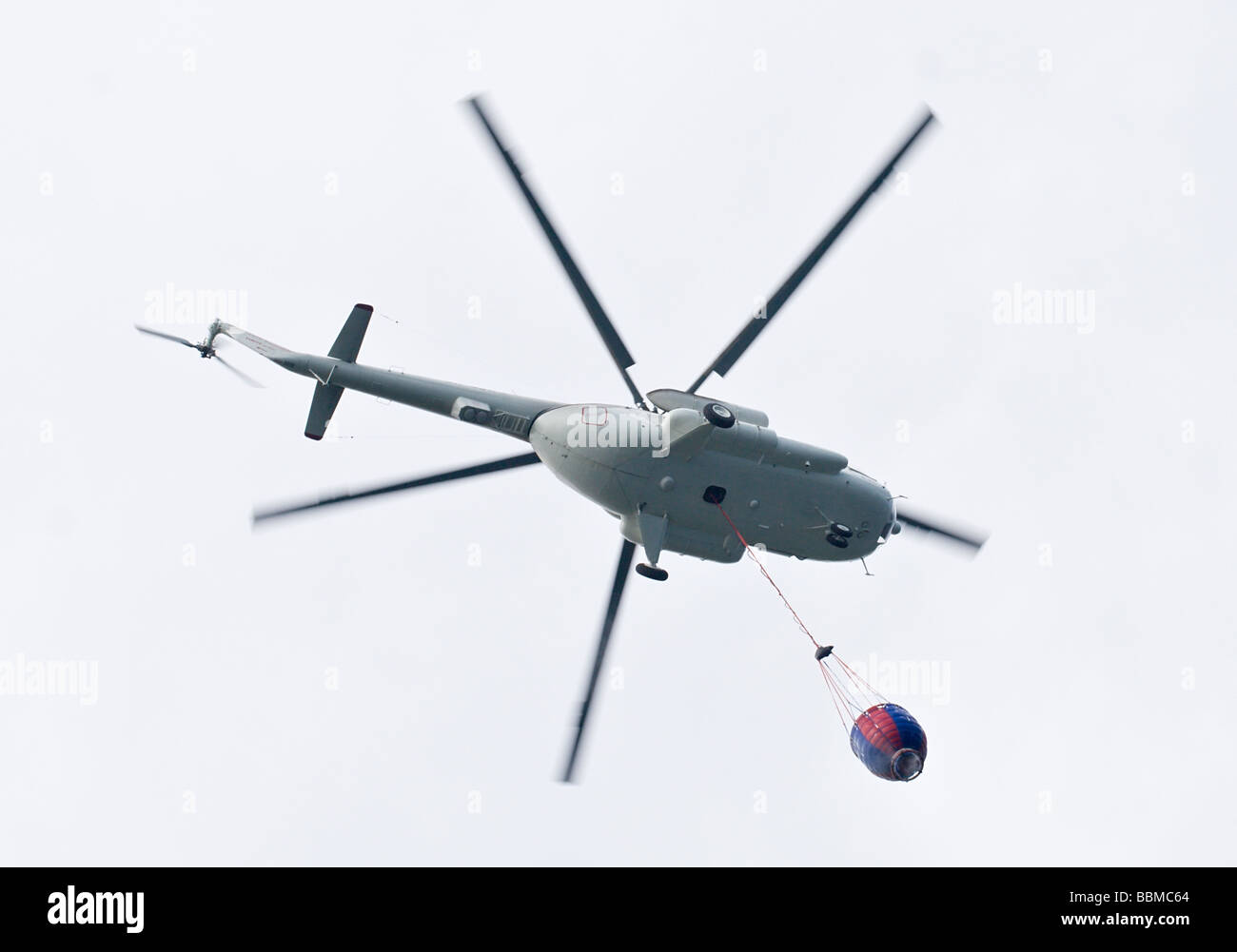 fire helicopter taking water from the sea to its special tank Stock ...