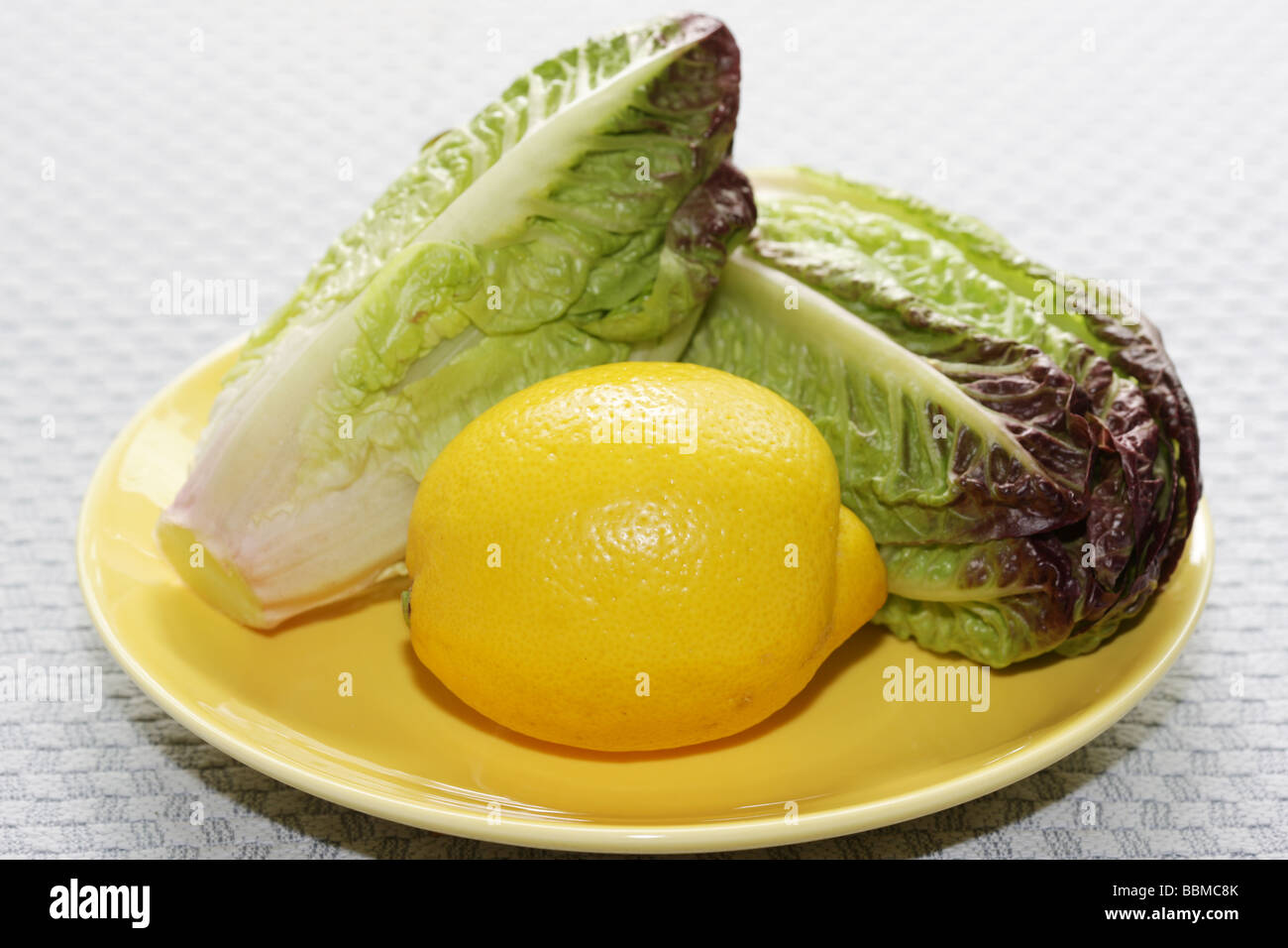 Gem Lettuce and Lemon Stock Photo - Alamy