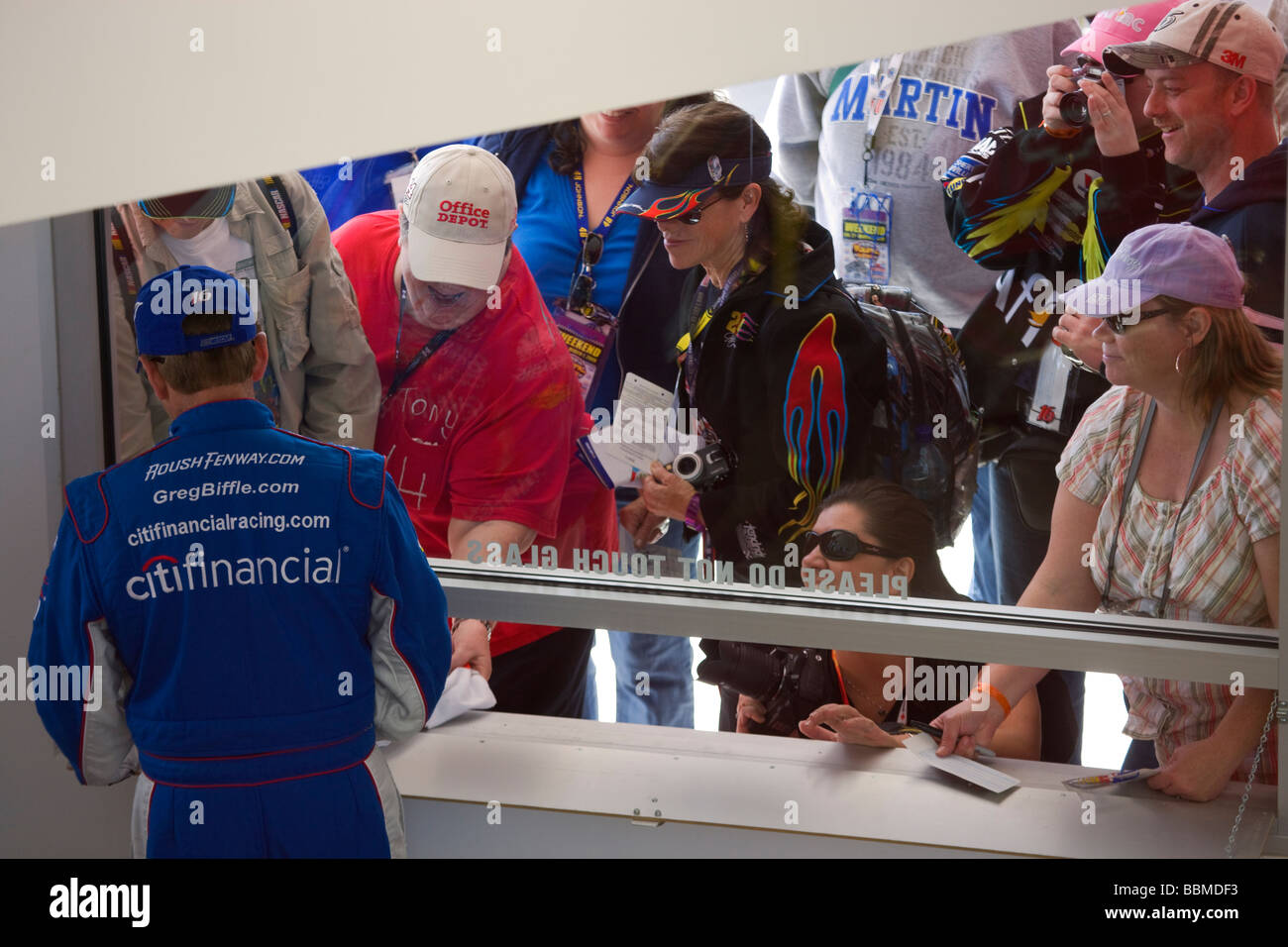 Greg Biffle signs autographs during qualifying for the Shelby 427 2009 ...