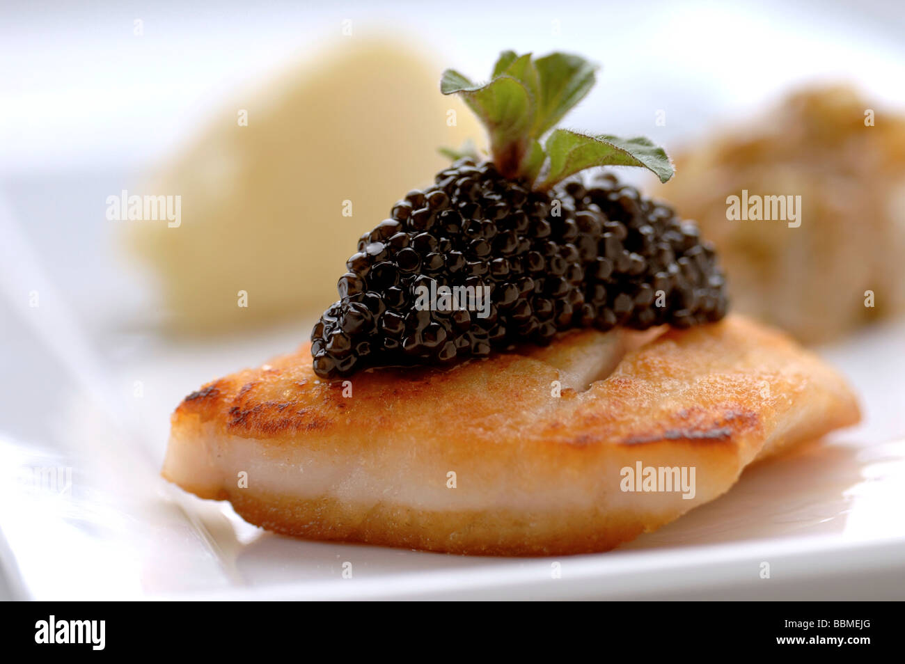 Caviar with baked fish Stock Photo - Alamy