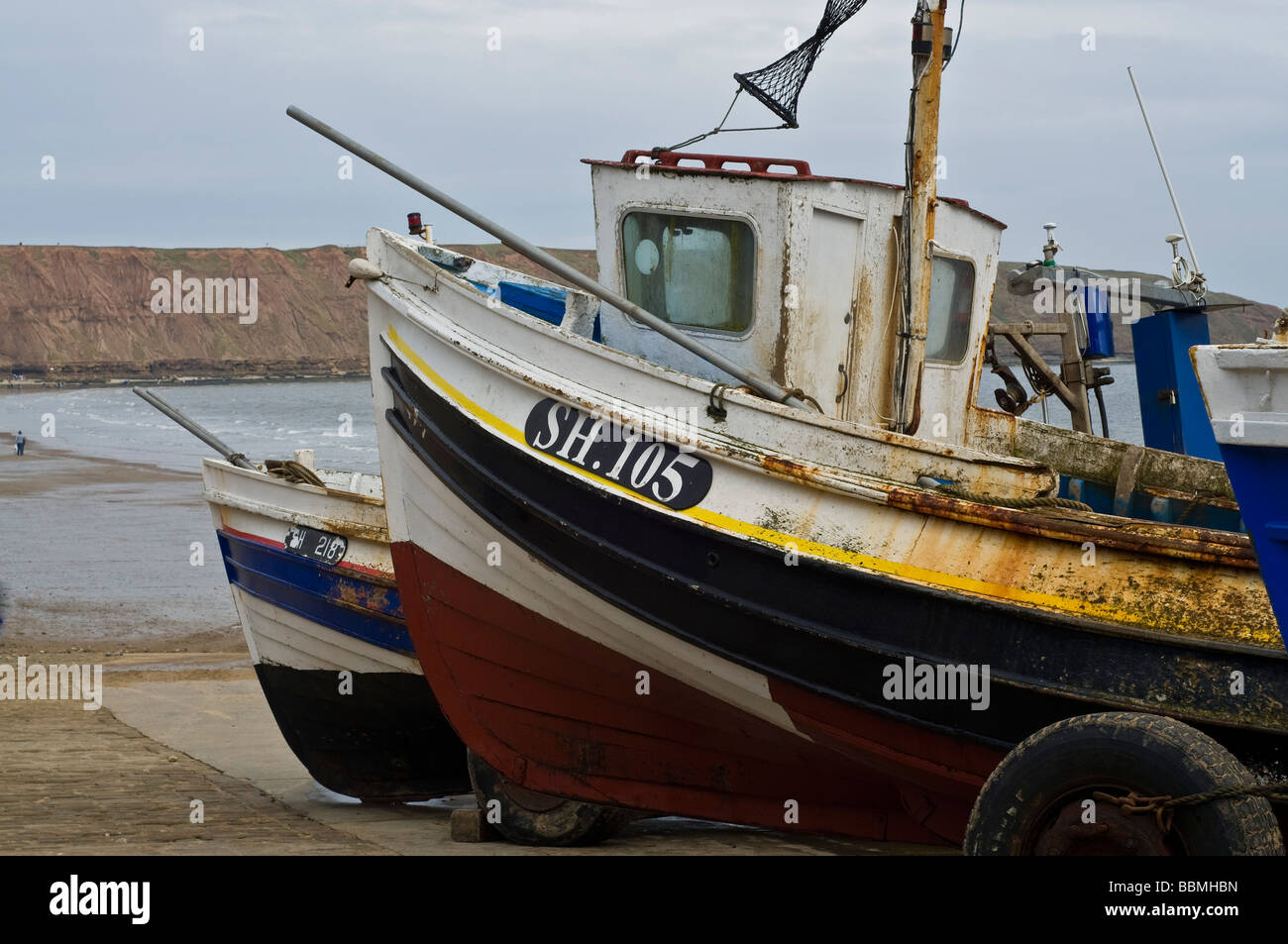 dh Coble Landing FILEY NORTH YORKSHIRE Fishing boats beached on beach ...