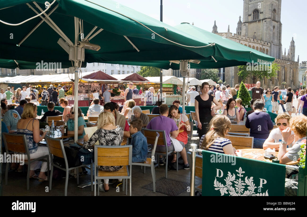 People eating at an outside restaurant in the market square, Cambridge ...