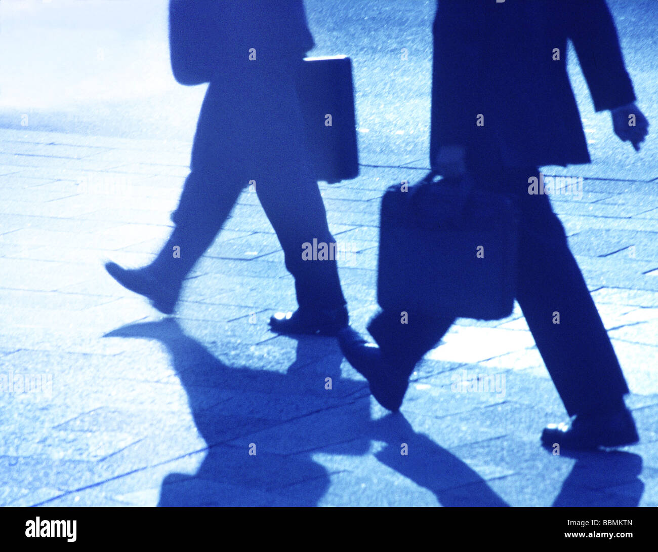 Two businessmen walking on street Stock Photo - Alamy