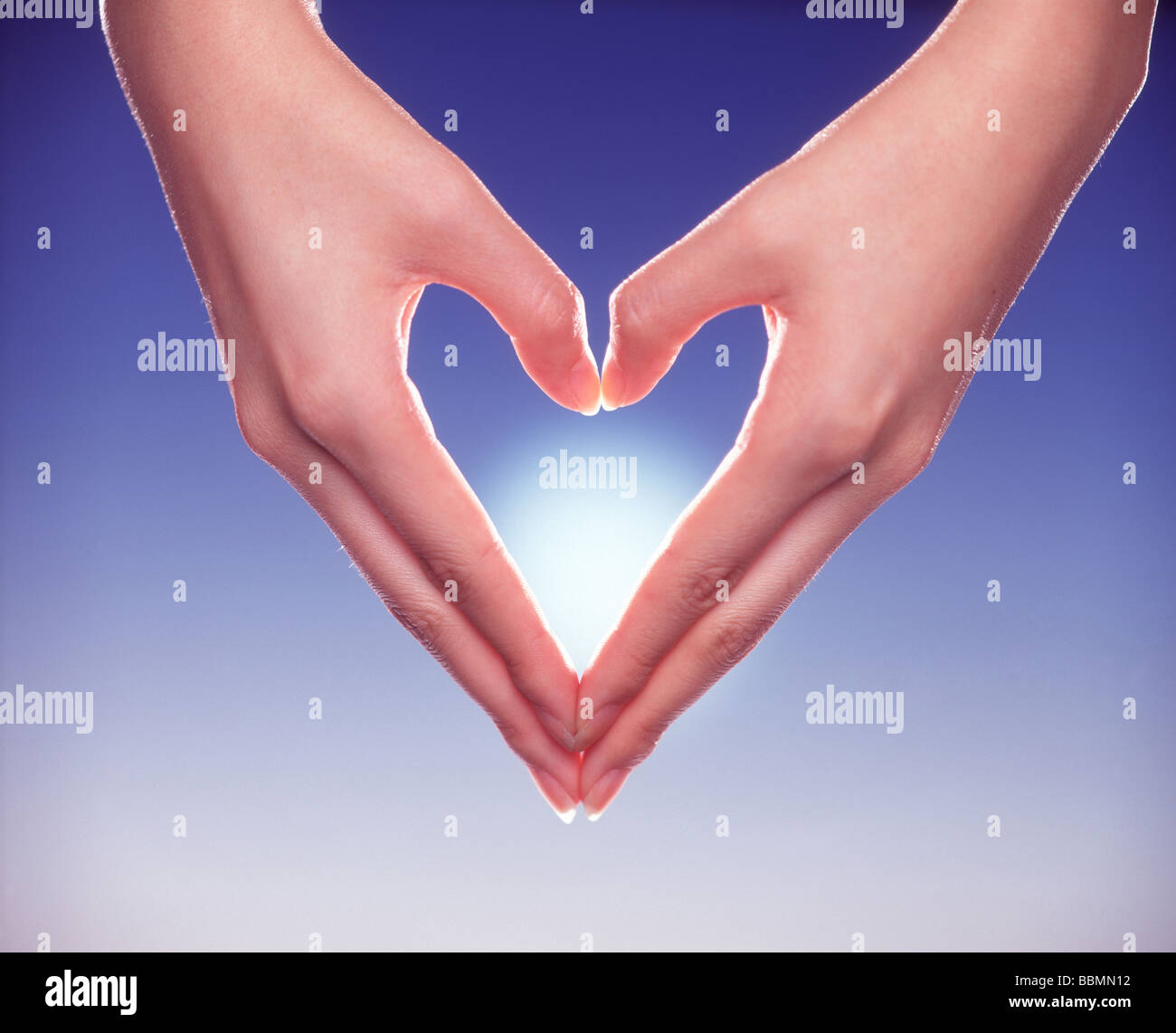 One heart with two hands hi-res stock photography and images - Alamy