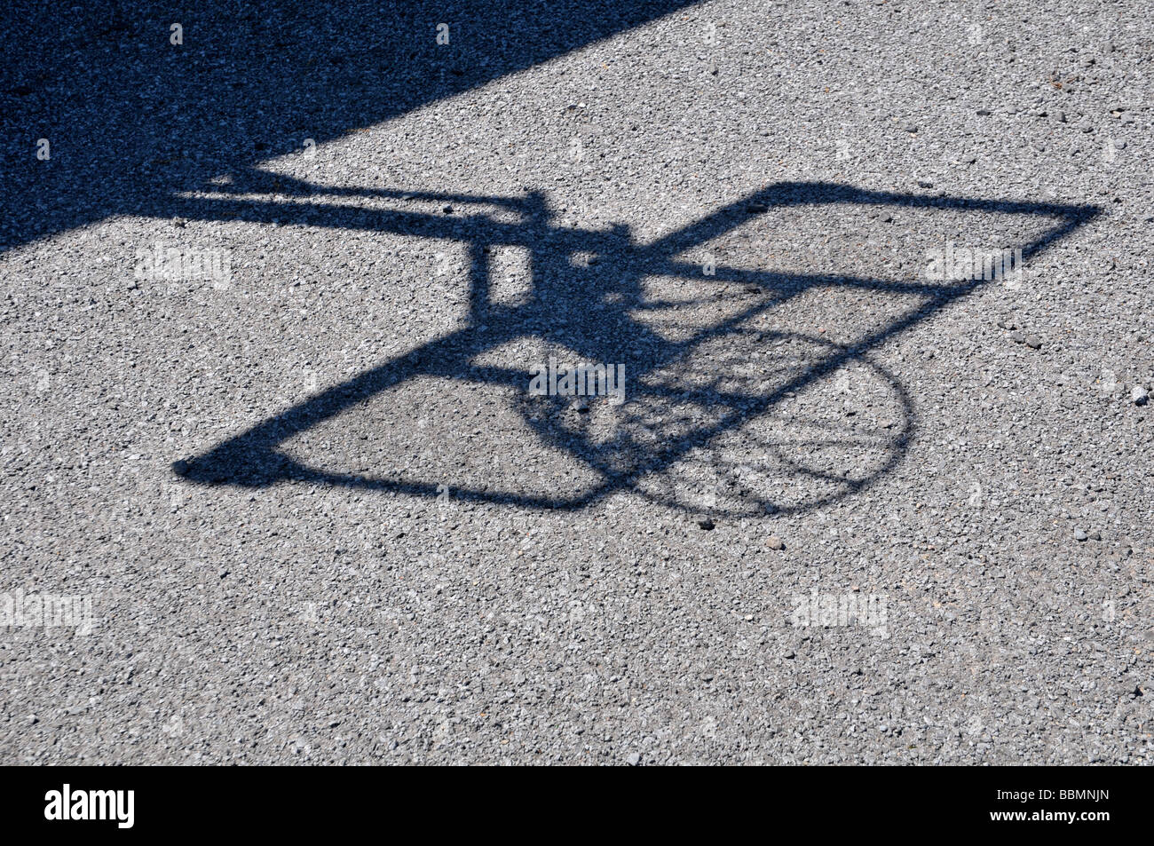 Shadow of basket ball hoop on blacktop Stock Photo - Alamy