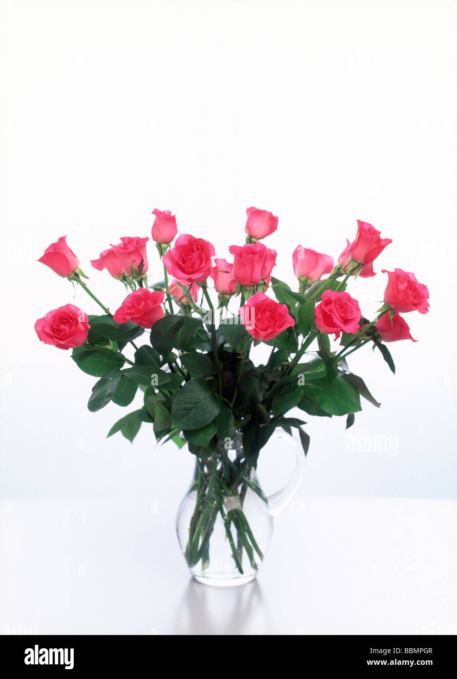 A bunch of roses in a jar Stock Photo - Alamy