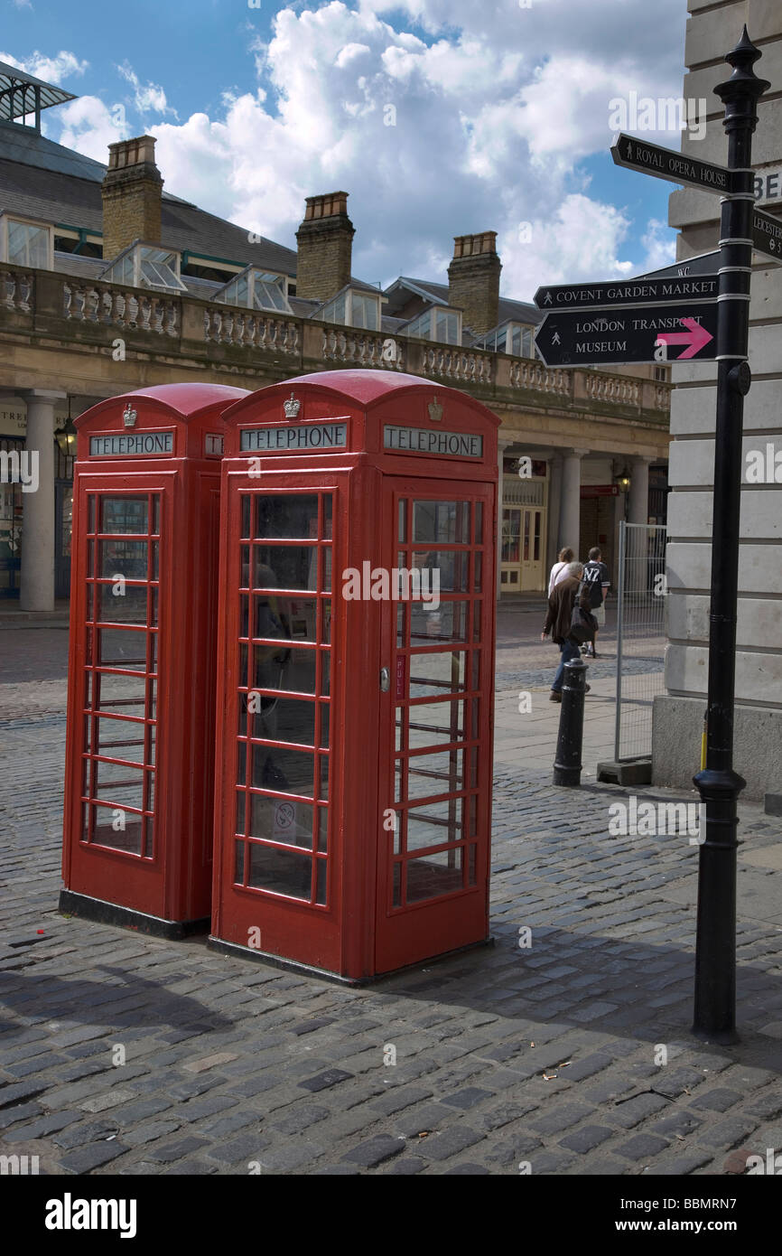 Two iconic red telephone boxes in Covent garden Market in London Stock ...