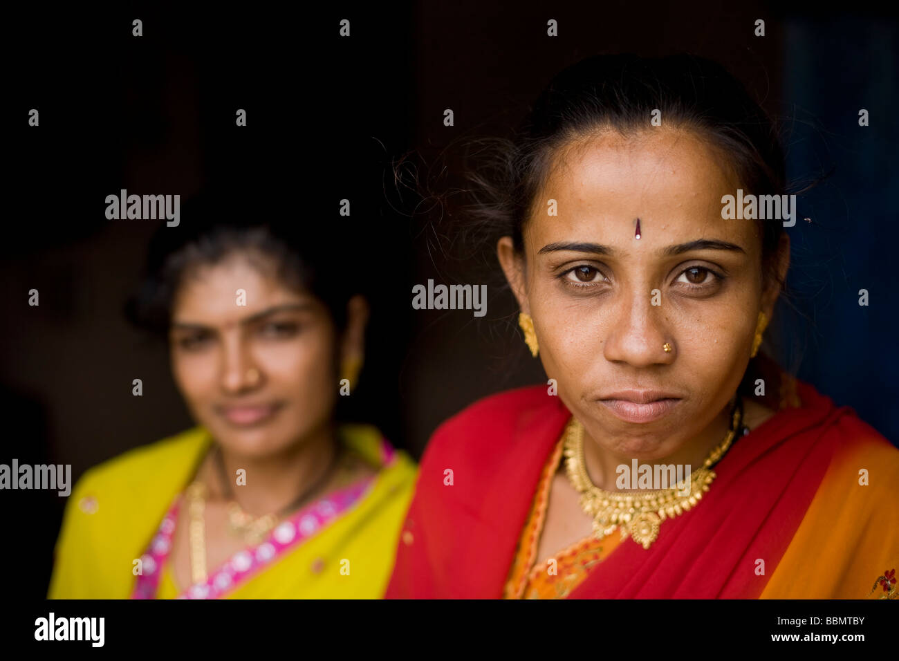 Portrait of two rural Indian Hindu women in traditional dress (sari ...
