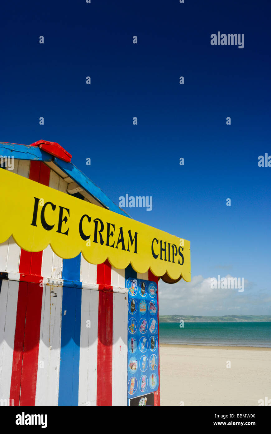 small beach stall selling ice cream and chips on the beach at weymouth ...