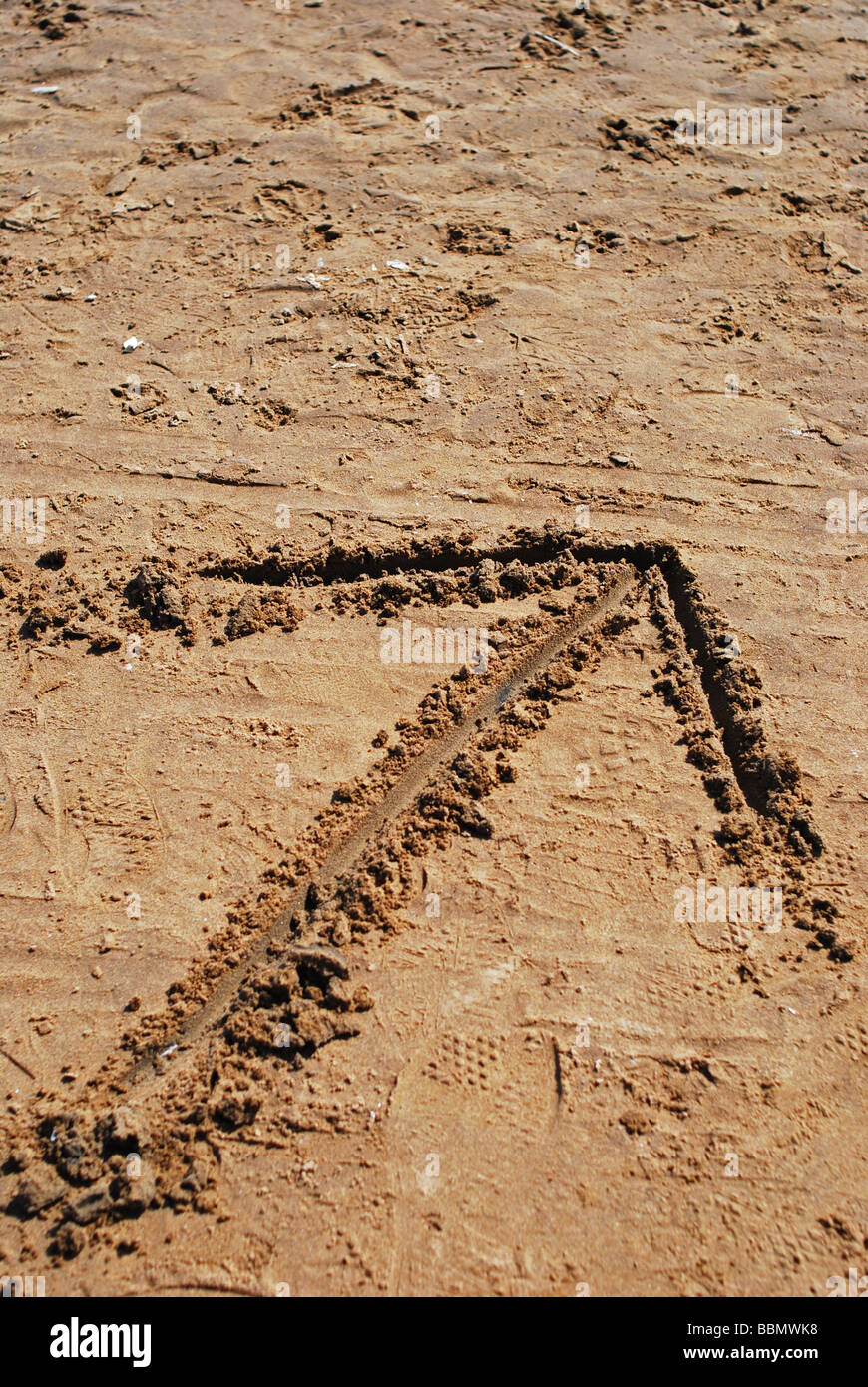 Arrow in the Sand Stock Photo - Alamy