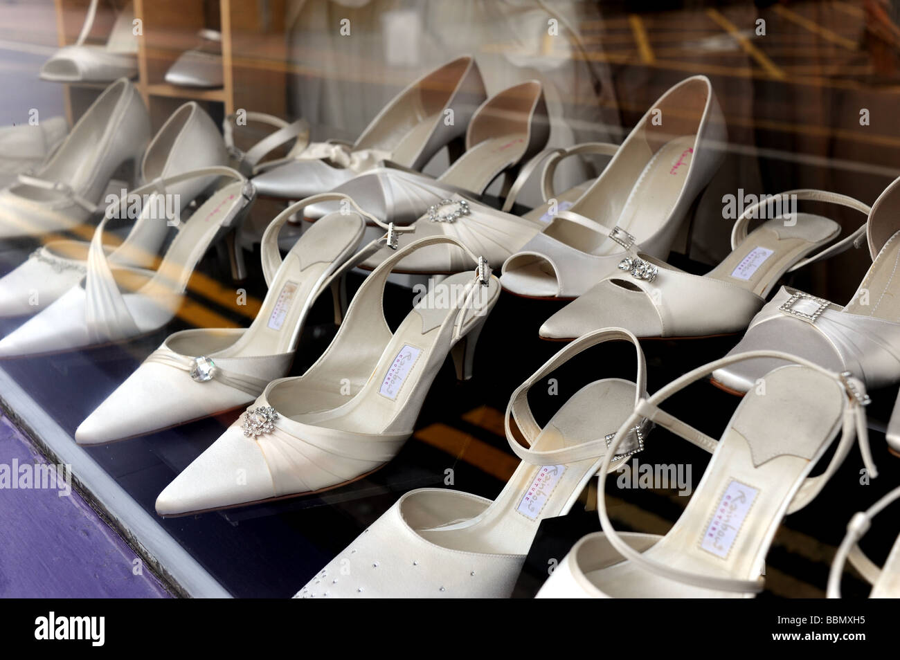 White wedding shoes on display in a shop window in Brighton Stock Photo ...