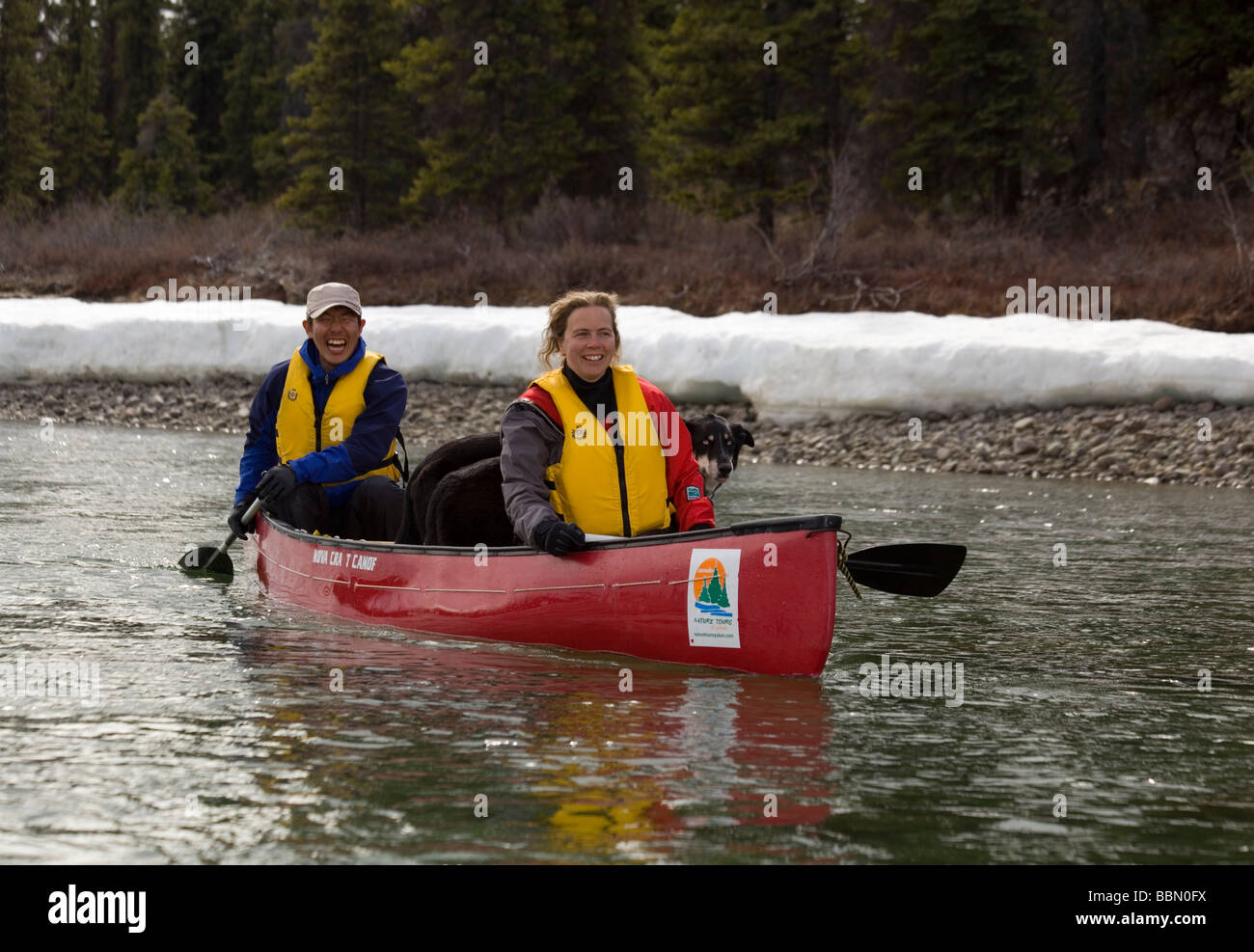 Canoing on Takhini River, snow on shore, Yukon Territory, Canada, North ...