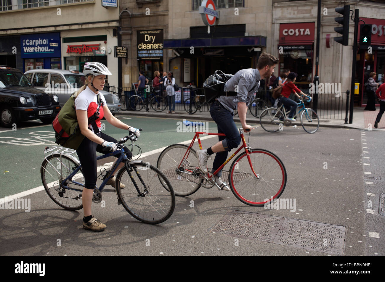 Young Woman Riding Bicycle to Work Stock Photo - Alamy