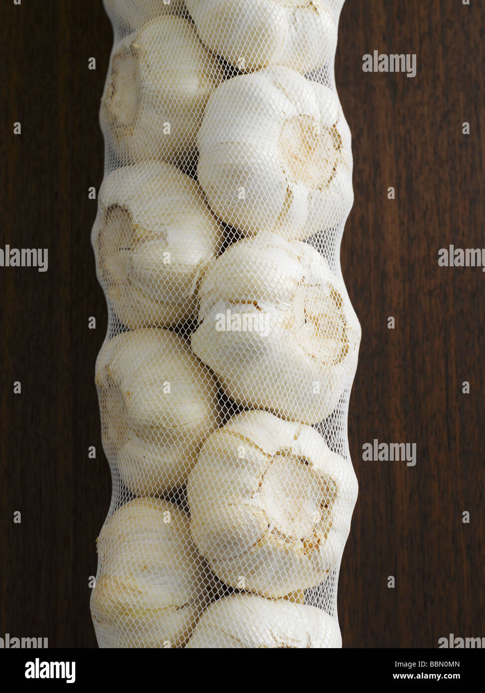 Fresh garlic (Allium sativum) in net Stock Photo - Alamy
