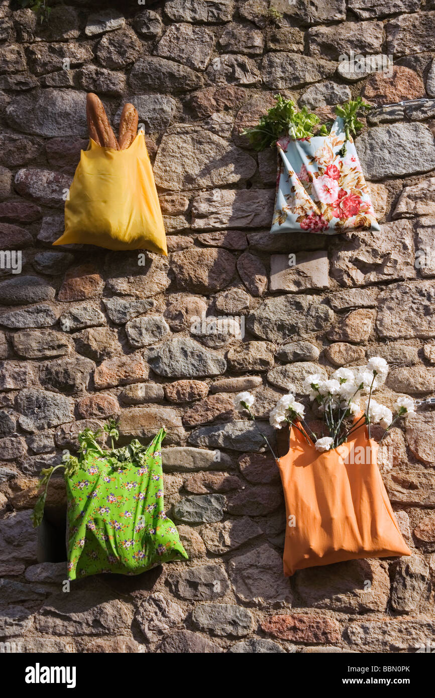 shopping bags on a wall Stock Photo - Alamy