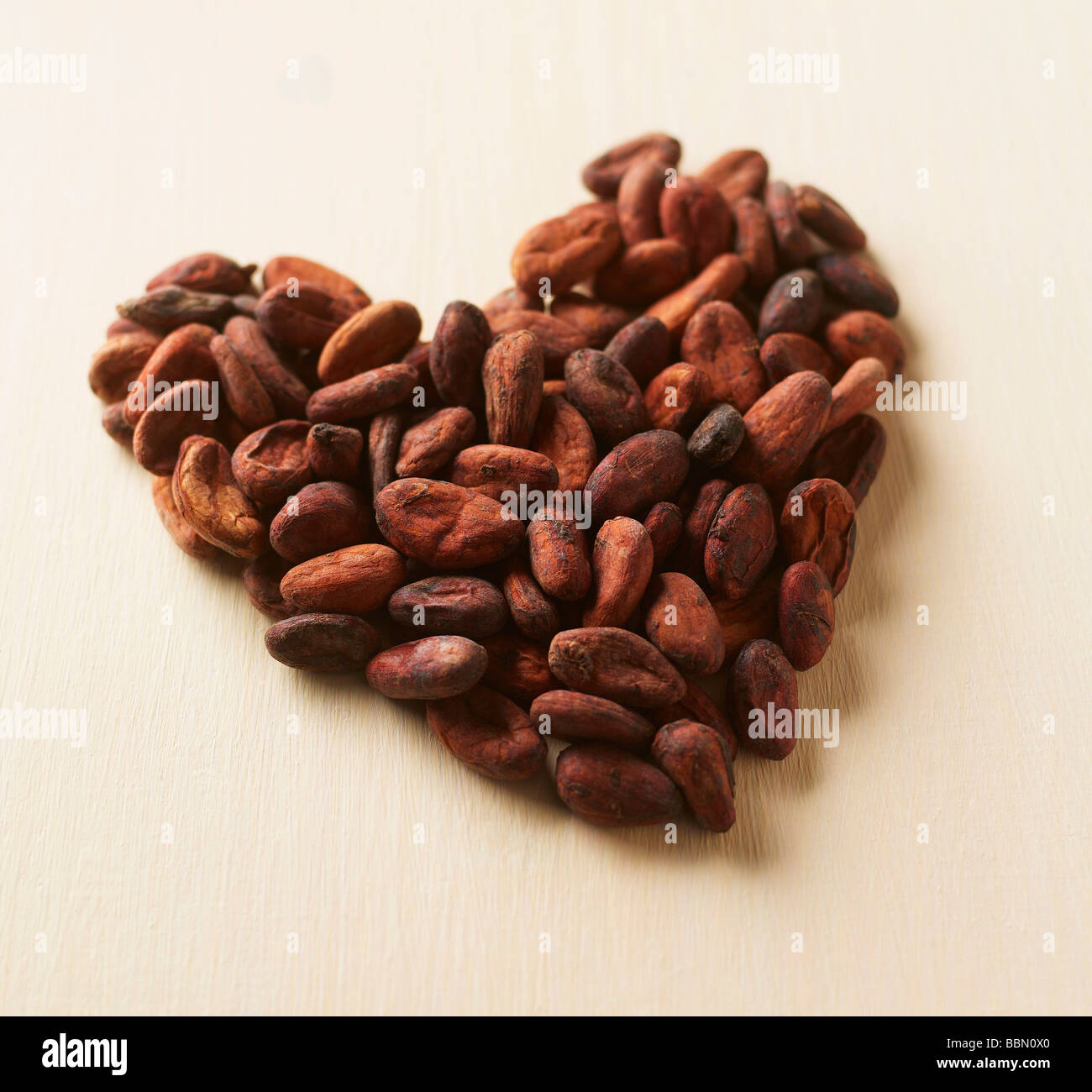 Cocoa beans, heart-shaped, elevated view Stock Photo - Alamy