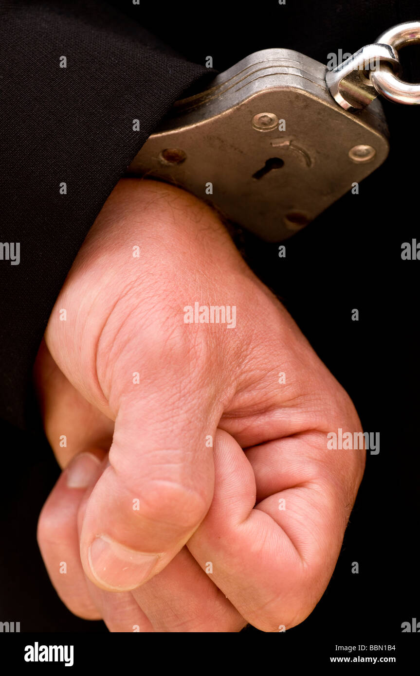 Man in handcuffs Stock Photo - Alamy