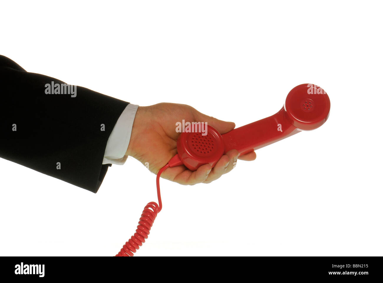 Manager's hand holding a telephone handset Stock Photo - Alamy