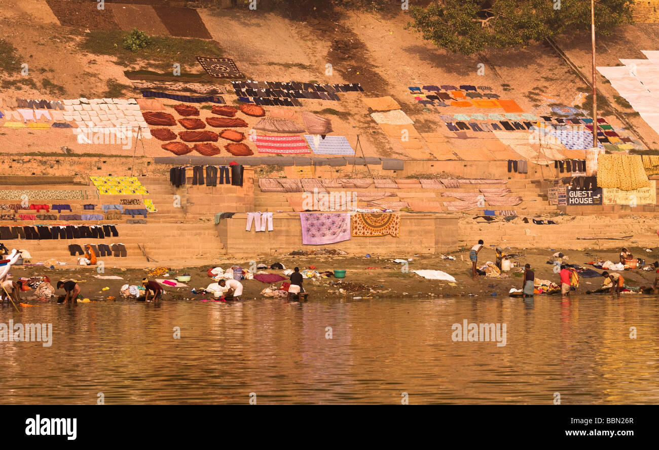 The Ganges,Varanasi,India;People washing and drying fabric by the river ...