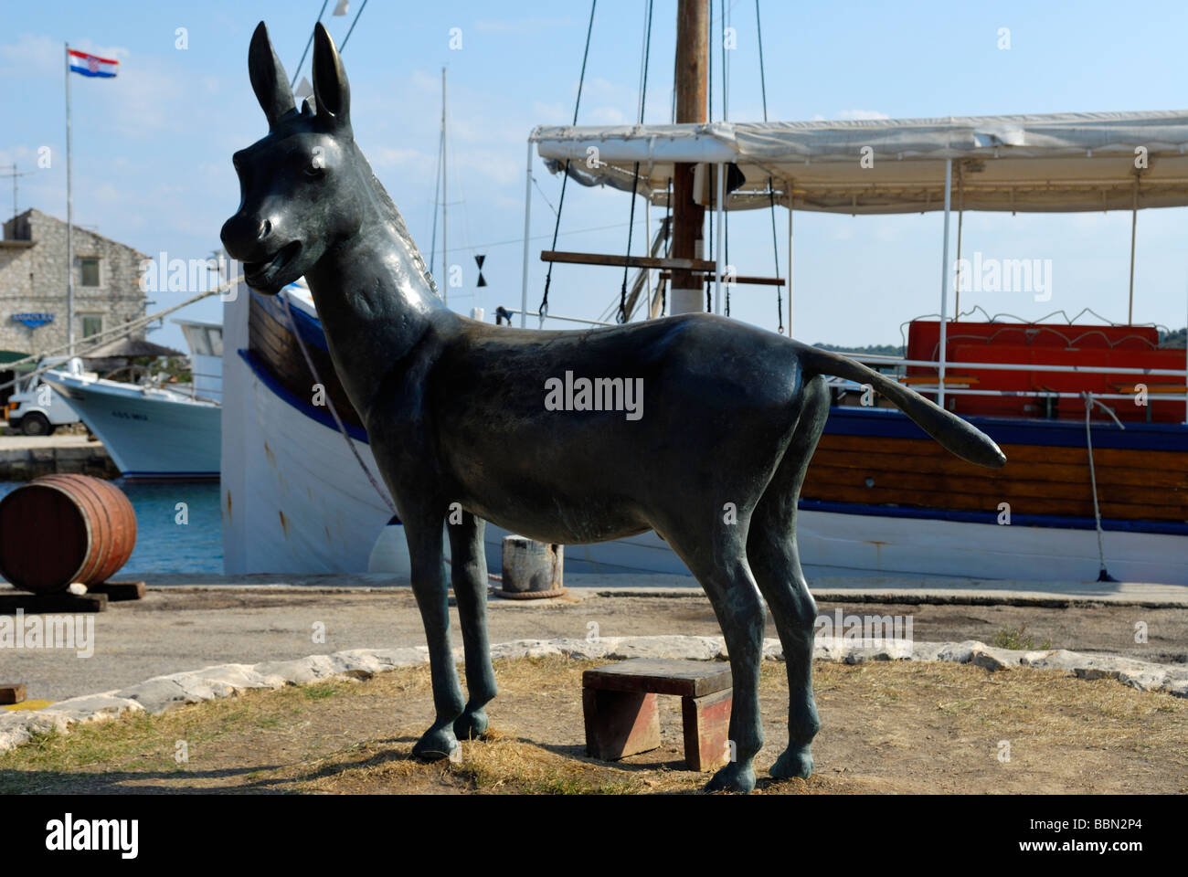 Lifesize bronze cast of a donkey on seafront at Tribunj on Dalmatian ...