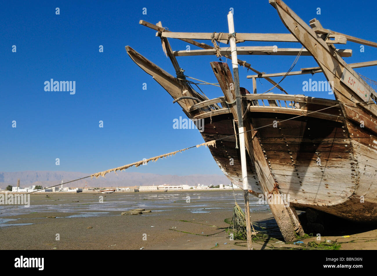 Fishing dhow in a shallow lagoon, Sur harbour, Al Sharqiya Region ...