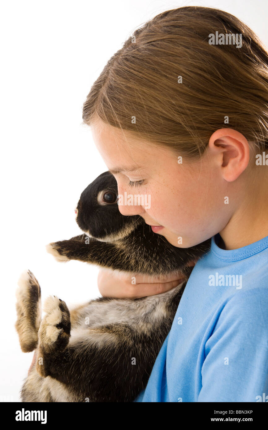 A girl cuddling with her bunny Stock Photo - Alamy