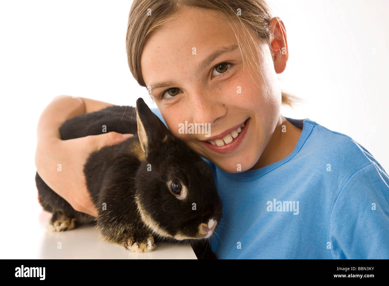A girl cuddling with her bunny Stock Photo - Alamy
