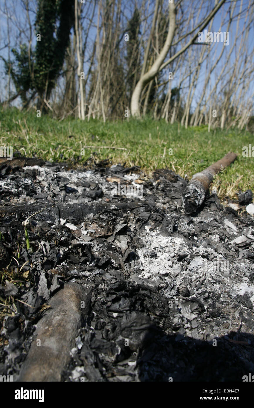 old camp fire in field in woods in countryside Stock Photo - Alamy