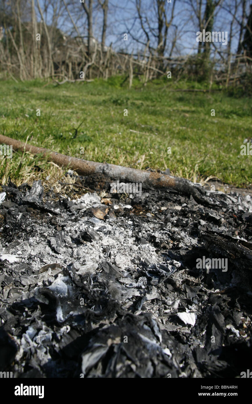 old camp fire in field in woods in countryside Stock Photo - Alamy