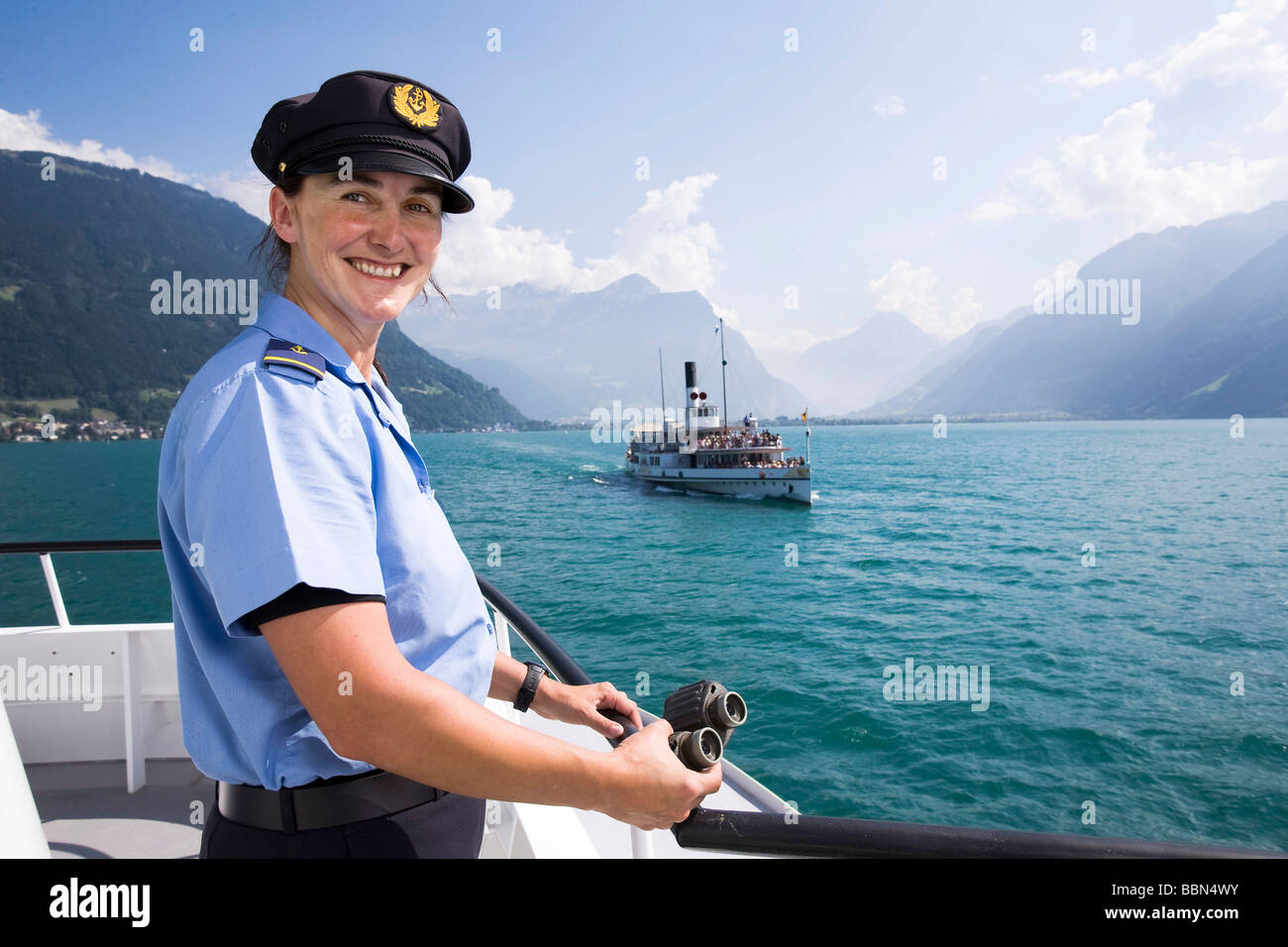 Ship's captain of a passenger motor vessel passing a steamer on Lake ...