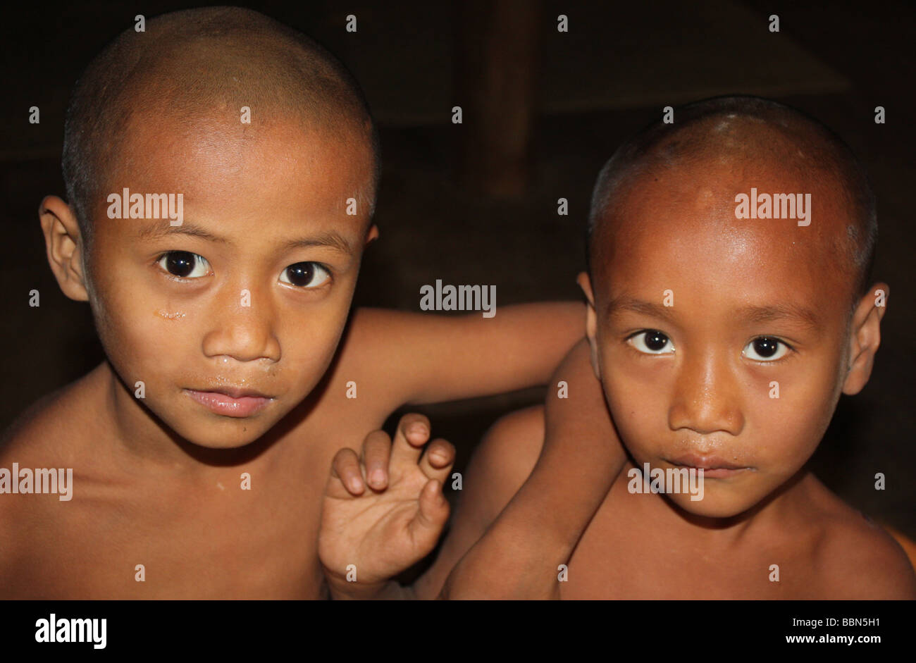 Two young Burmese orphans in a monastery, Bagan, Myanmar Stock Photo ...