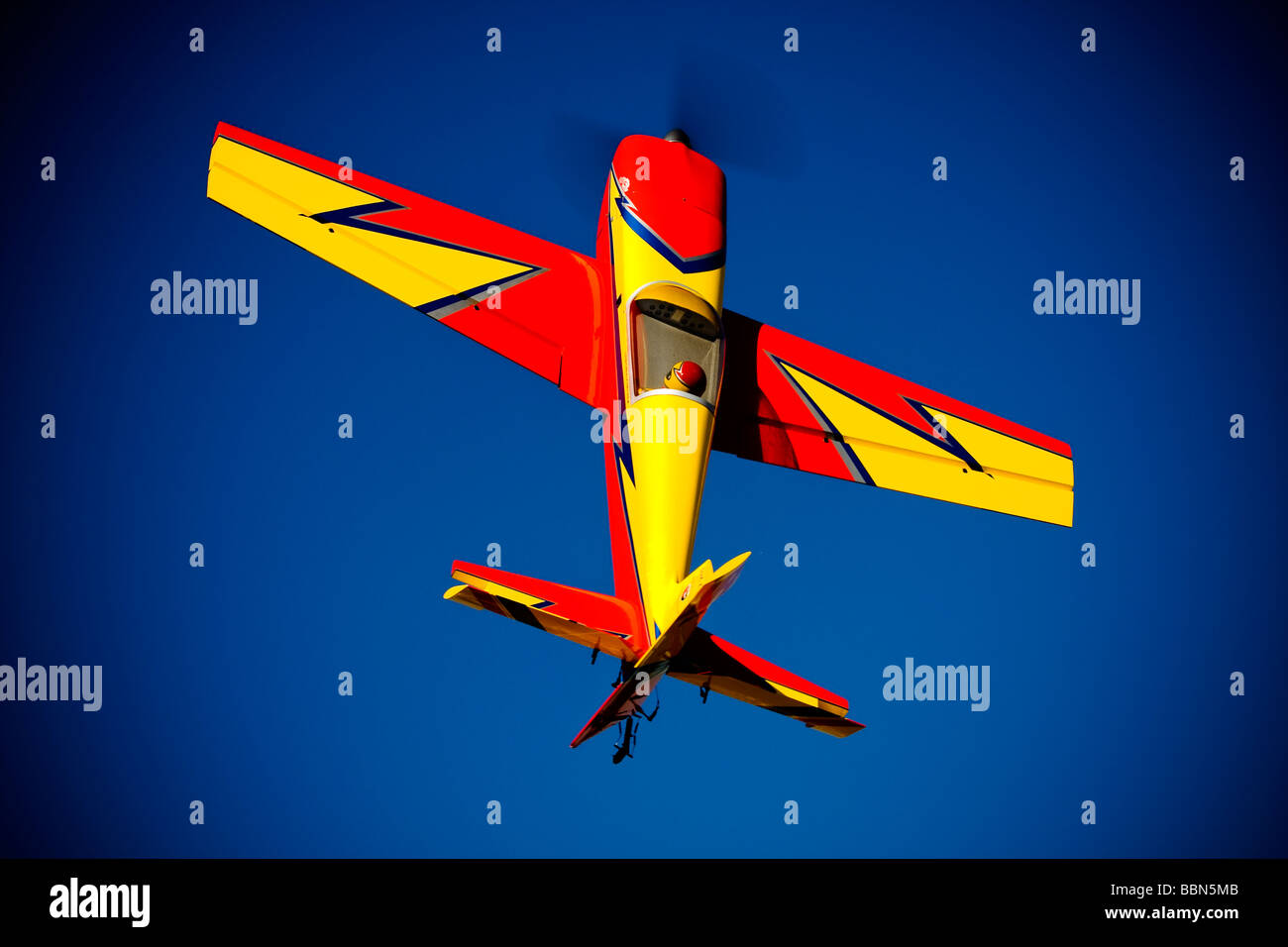 extra 330 aeromodel against blue sky Stock Photo - Alamy