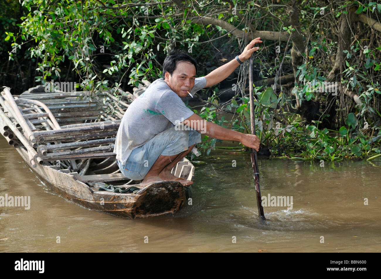 Man rows boat during hi-res stock photography and images - Alamy