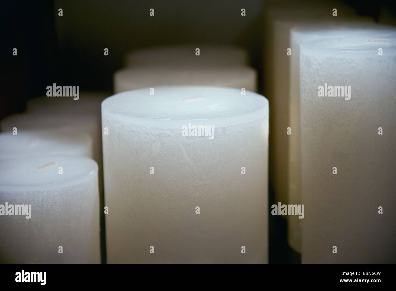 Various sized white candles Stock Photo - Alamy