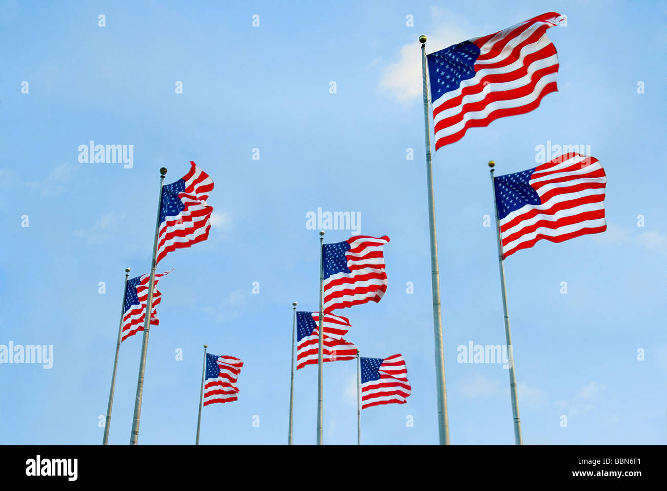 American flags blowing in the wind Stock Photo - Alamy
