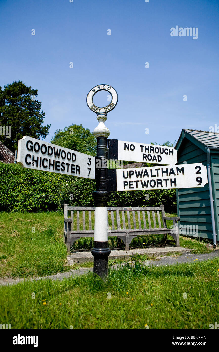 Local road and direction signs at East Dean village, West Sussex, UK ...