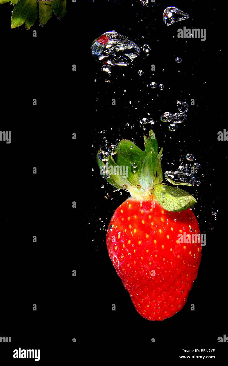 Strawberry in water Stock Photo - Alamy