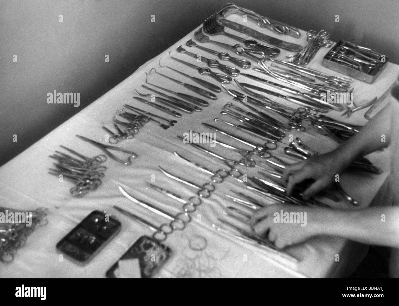 Table with surgical instruments in a german field hospital Black and ...