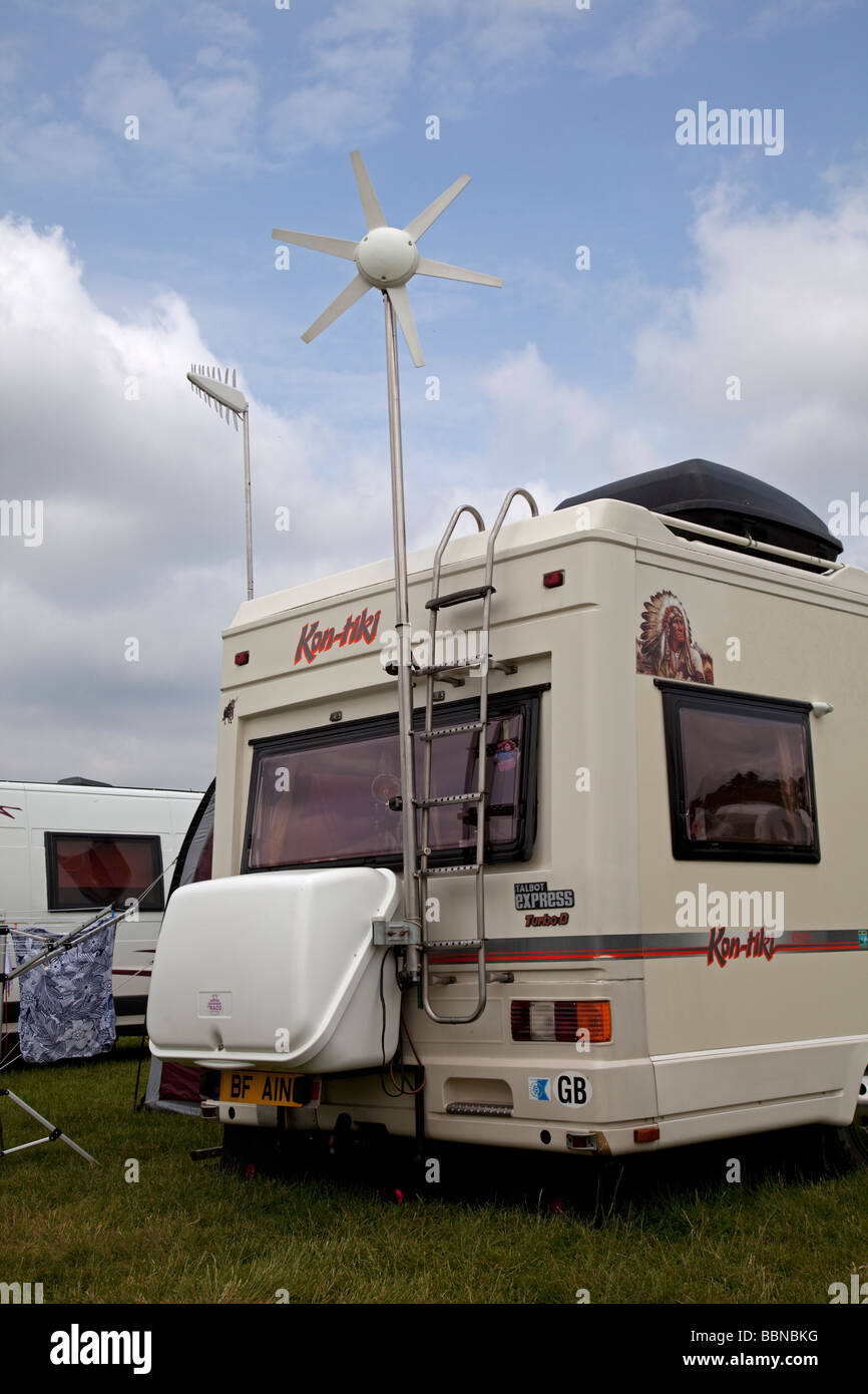 Small Rutland pole mounted wind turbine on motorhome against blue sky ...