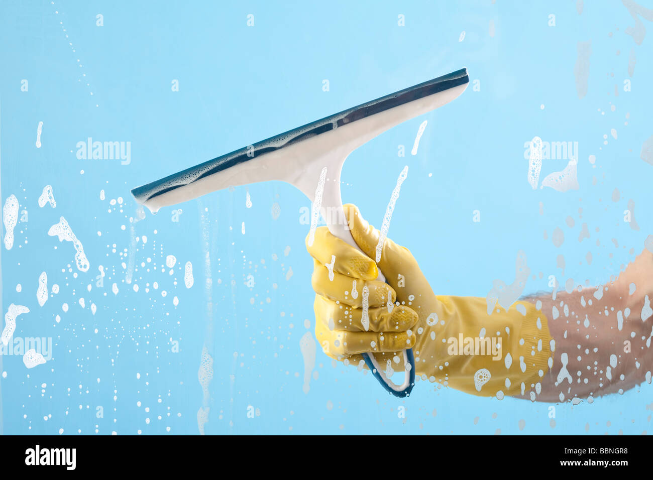 Person cleaning glass pane Stock Photo - Alamy