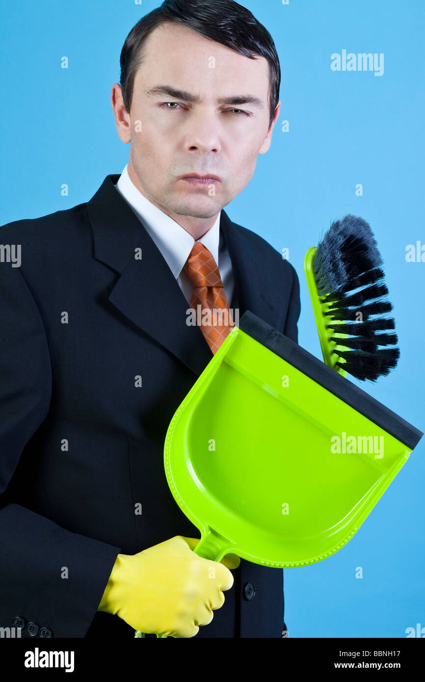Businessman dustpan brush hi-res stock photography and images - Alamy