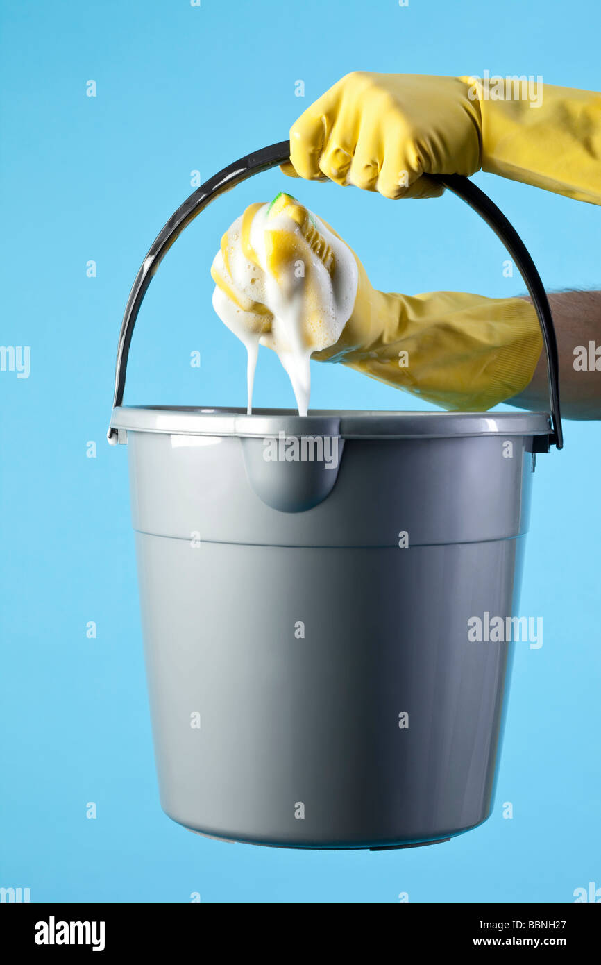 Person holding bucket, close-up Stock Photo - Alamy